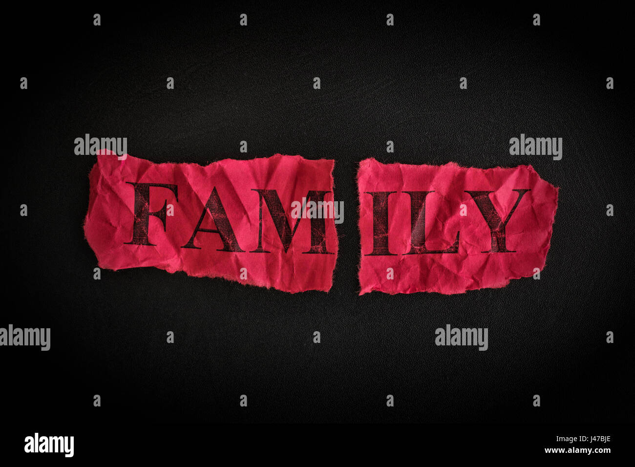 Family breakdown. Ripped piece of paper with the word "Family". Concept ...