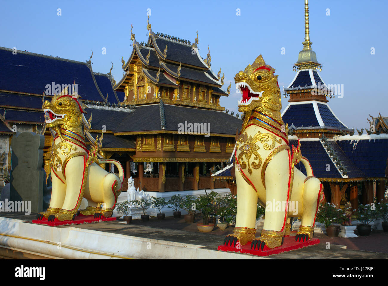Singha mythical lion figures at the Buddhist temple complex of Wat Ban ...