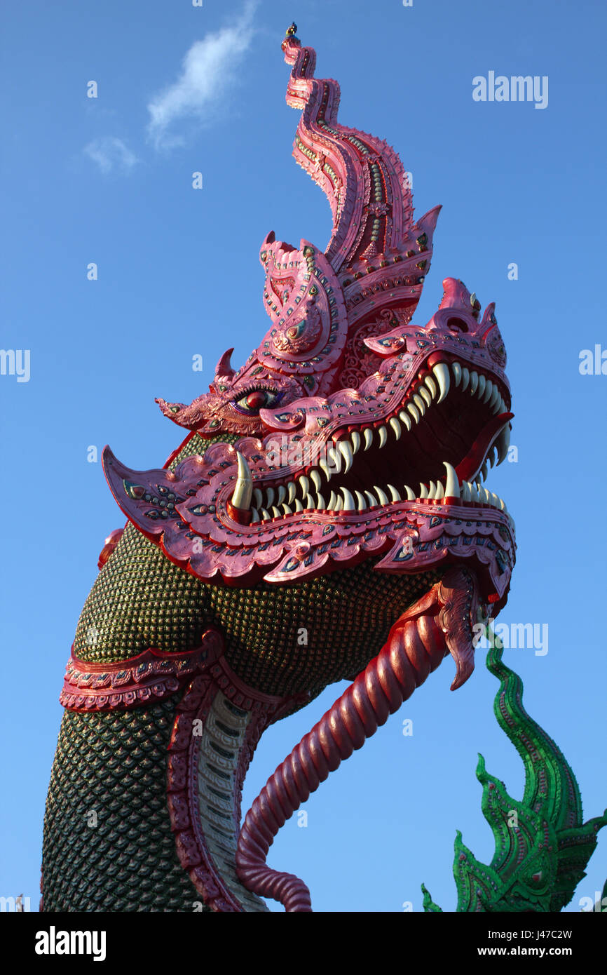 The fierce head of a naga, a mythical serpent of Buddhist tradition, a ...