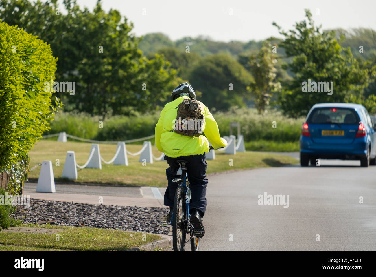Cyclist Wearing Hi Vis Jacket And Helmet High Resolution Stock ...
