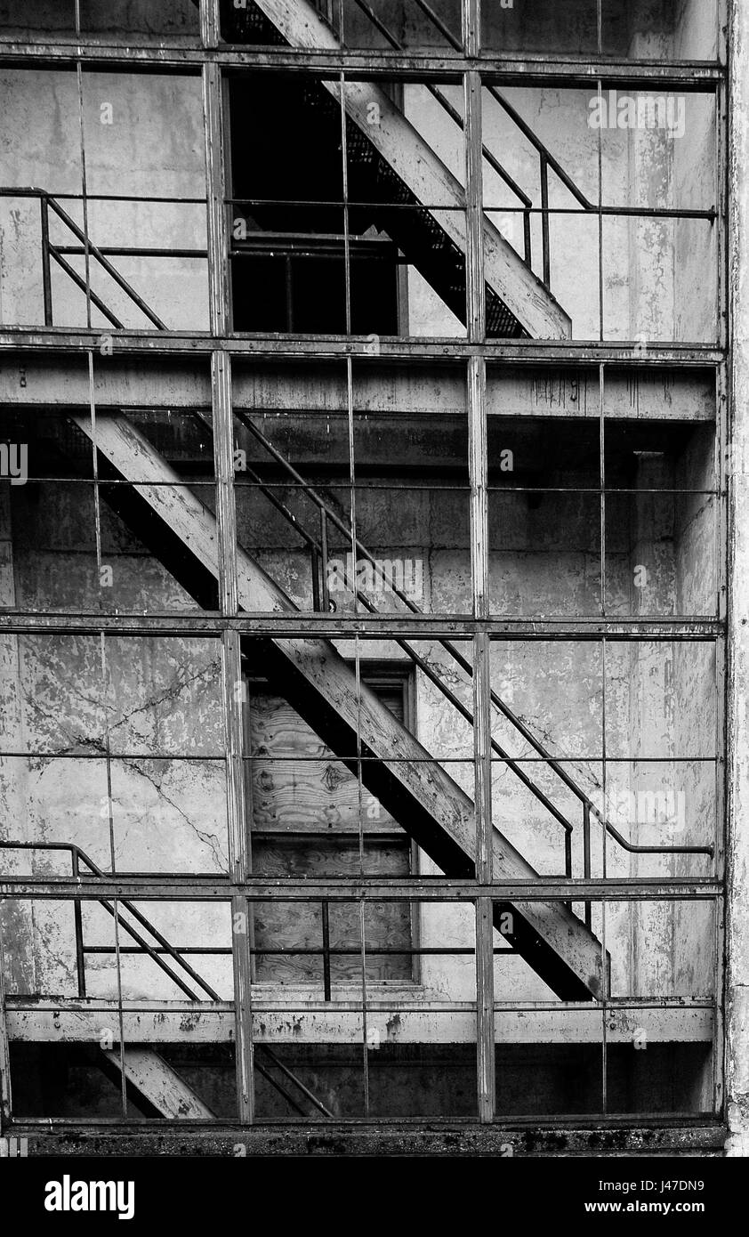 Exterior stairs on abandoned building deteriorating Stock Photo - Alamy
