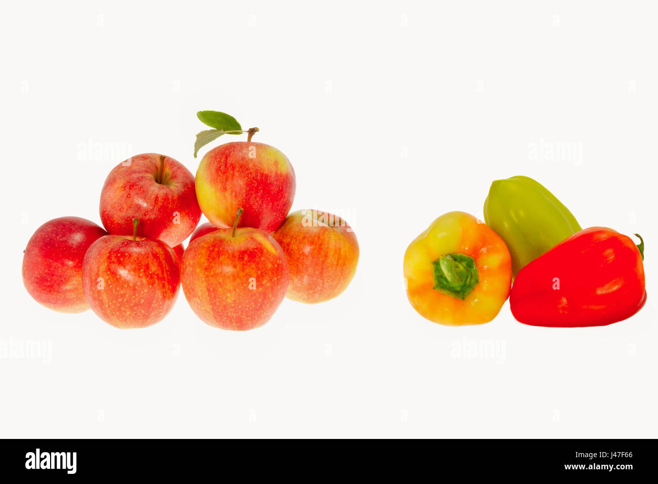 a Red ripe apples and sweet pepper on a white background Stock Photo ...
