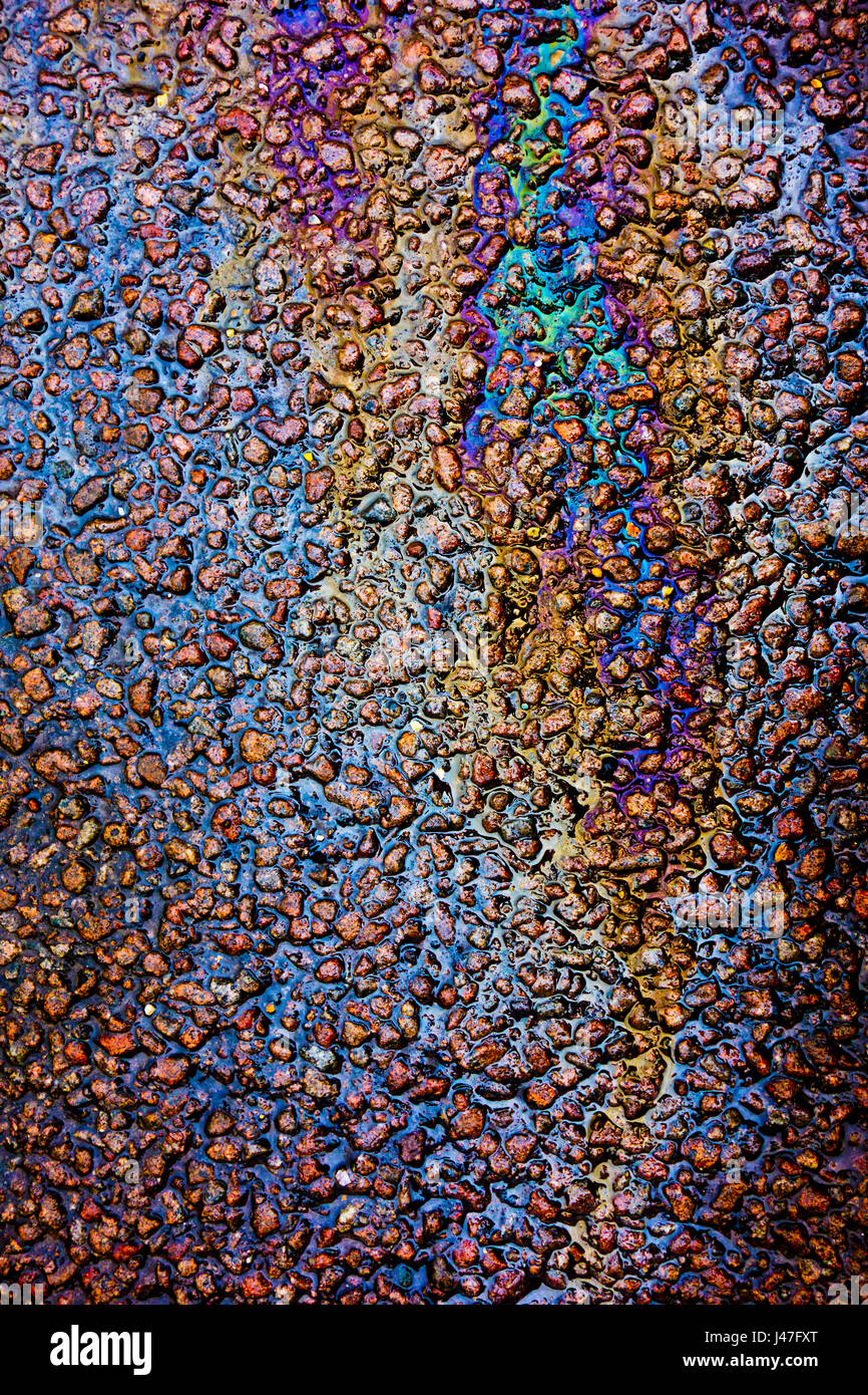 Rainbow Wet Petrol Oil on Road Abstract Background Stock Photo - Alamy