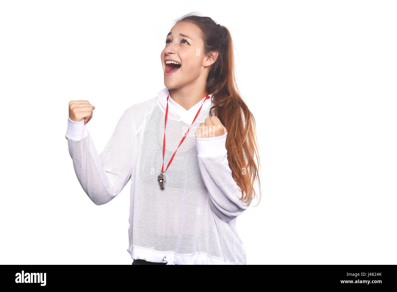 Portrait of beautiful and athlete young woman with whistle. Isolated ...