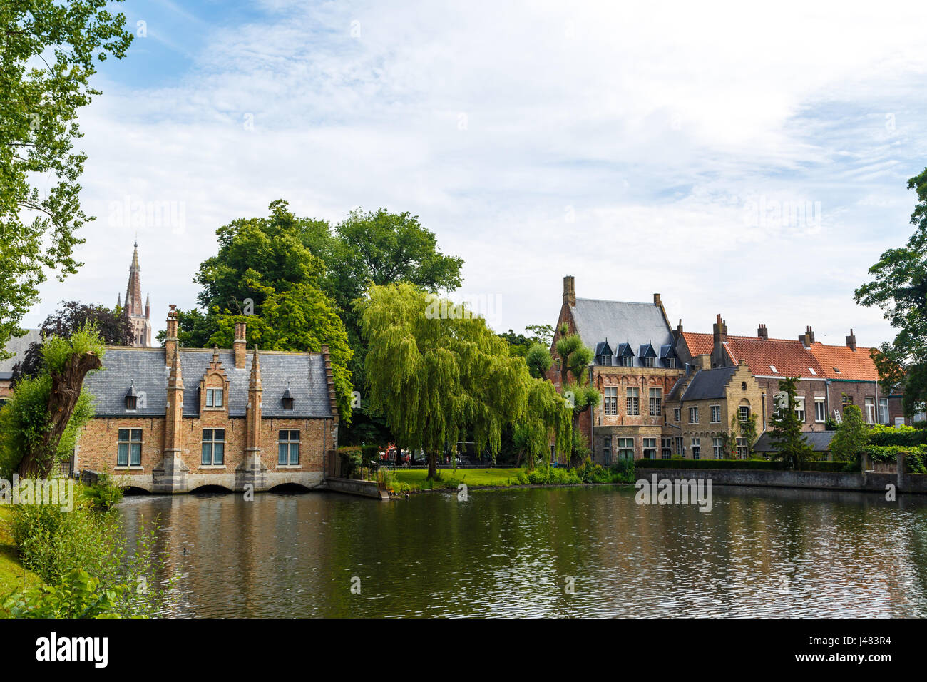 Spring time Minnewaterpark in Brugge (Bruges) with medieval ...