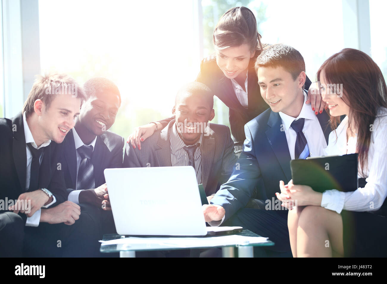 Happy working business team in modern office Stock Photo - Alamy