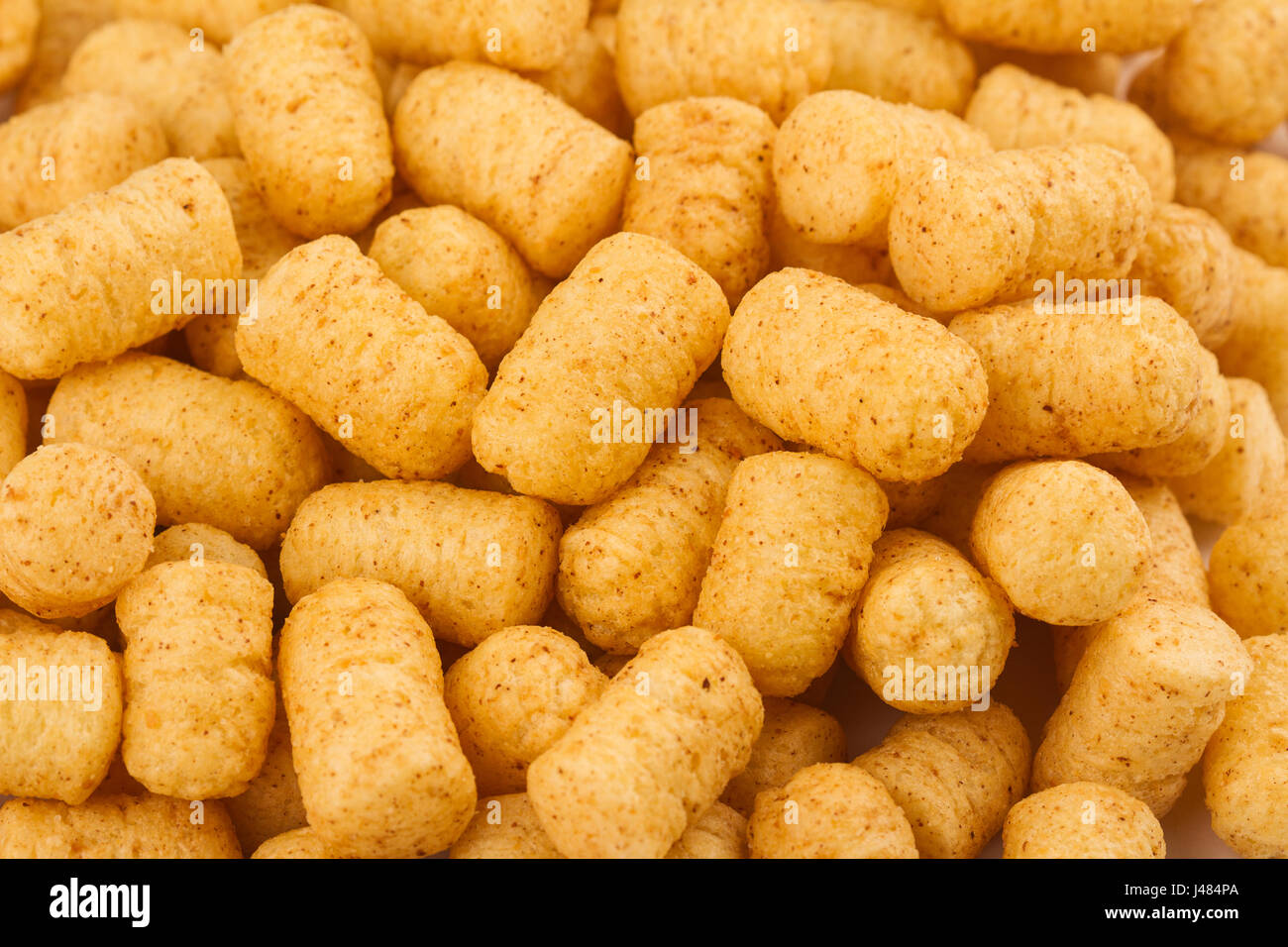 top view of many corn puff snacks textured background Stock Photo - Alamy