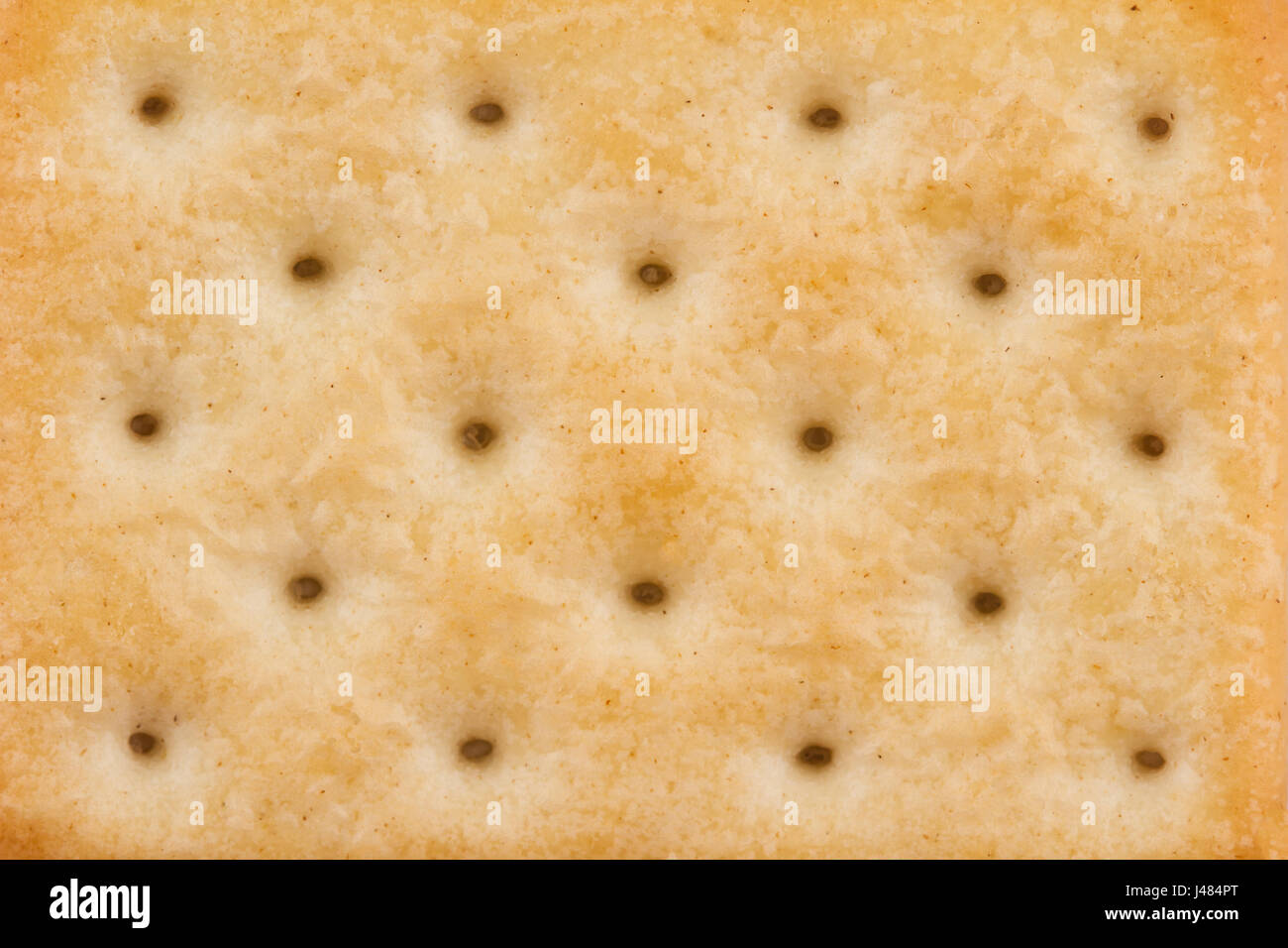 food background - closeup of square shaped salty brown biscuit texture ...