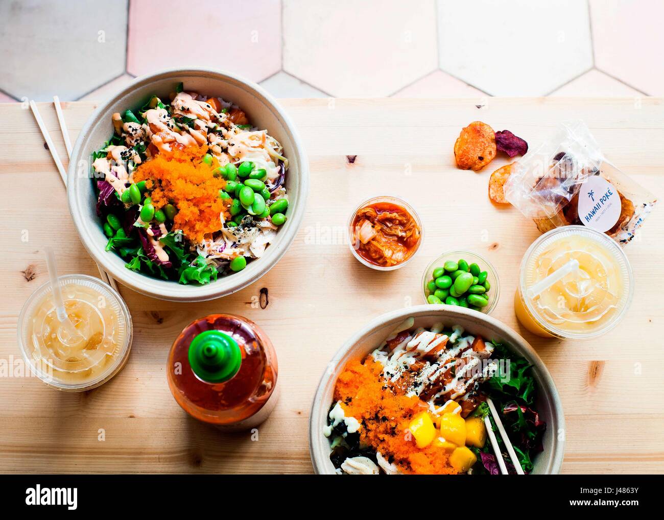 Poke bowls served with drinks Stock Photo - Alamy