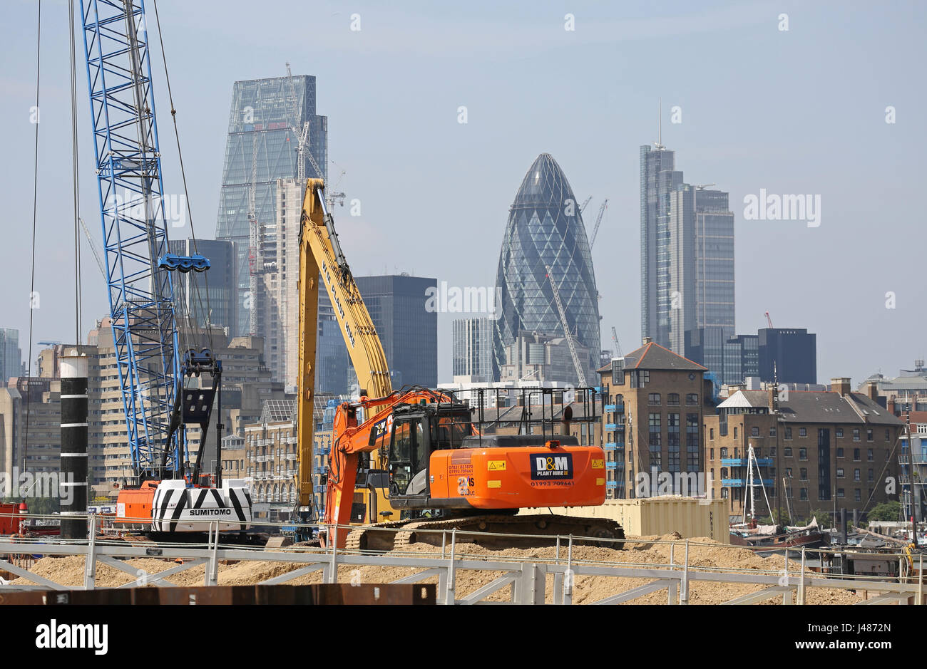 Thames Tideway project, London. An excavator and crane stand on a ...