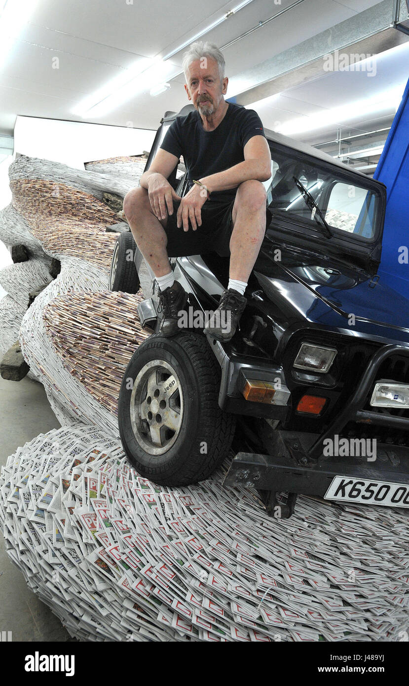 Turner prize nominated artist David Mach sits on his partially ...