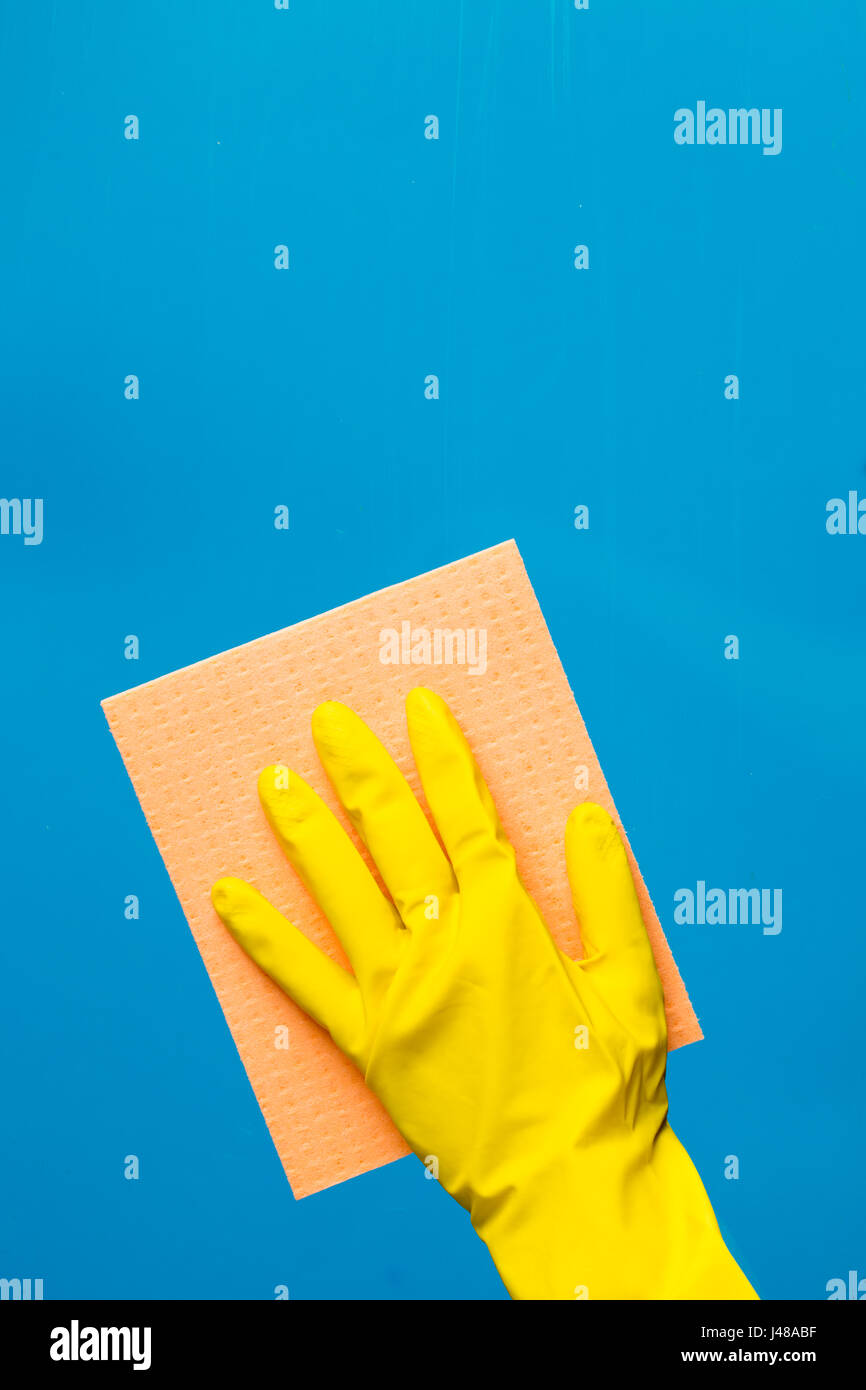 Hand with rag wipes glass Stock Photo - Alamy