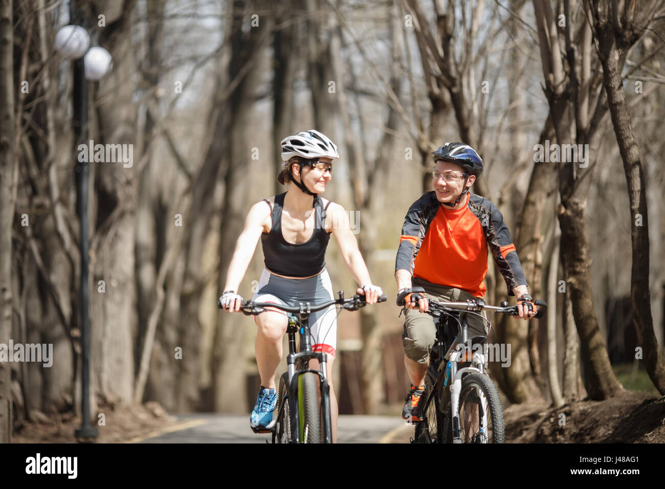 Two bicyclists drive around park Stock Photo - Alamy Two bicyclists drive around park Stock Photo - Alamy