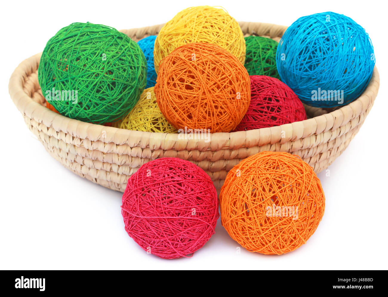 Decorative hollow thread rolls over white background Stock Photo - Alamy
