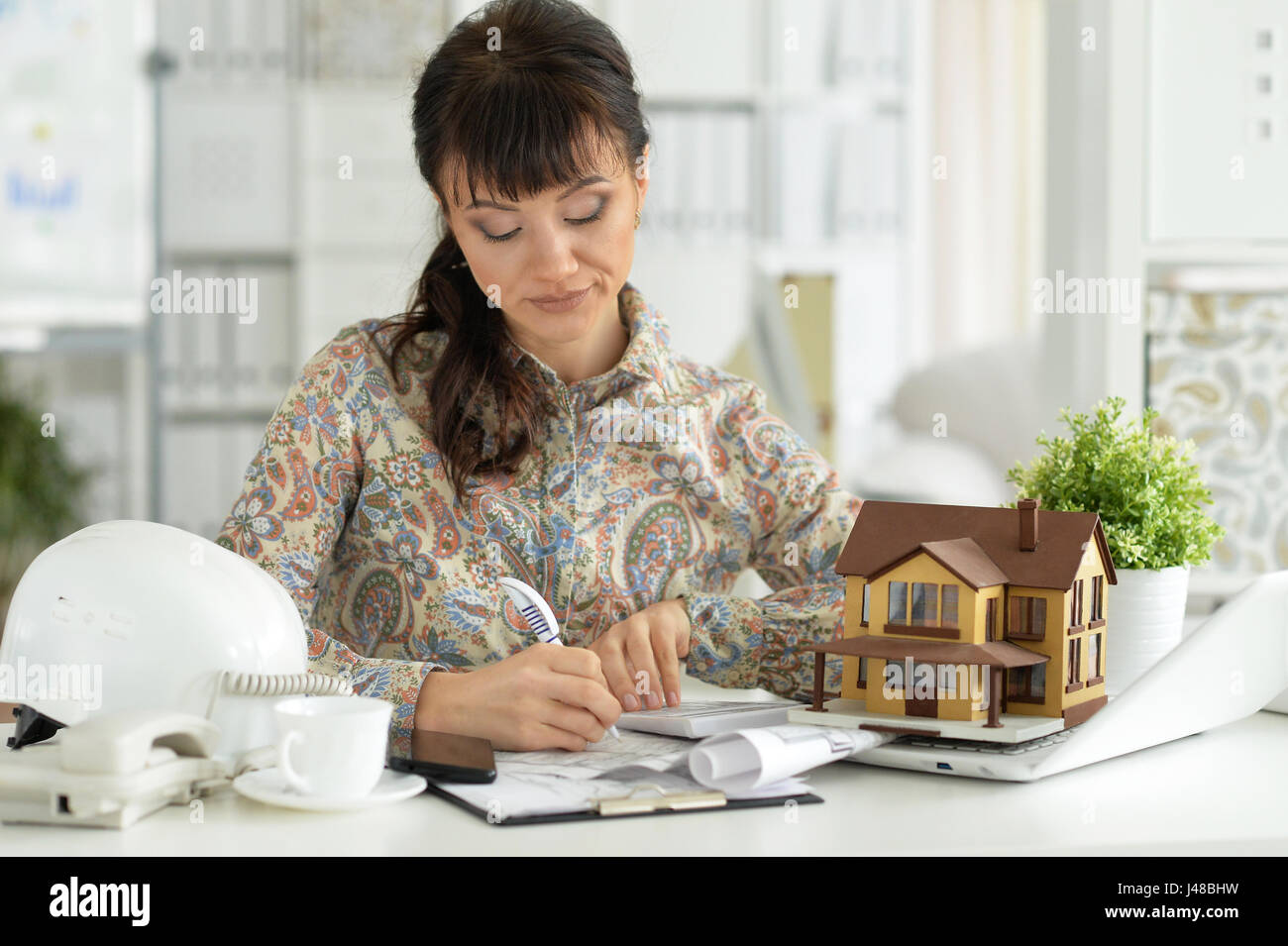 Female architect working Stock Photo - Alamy