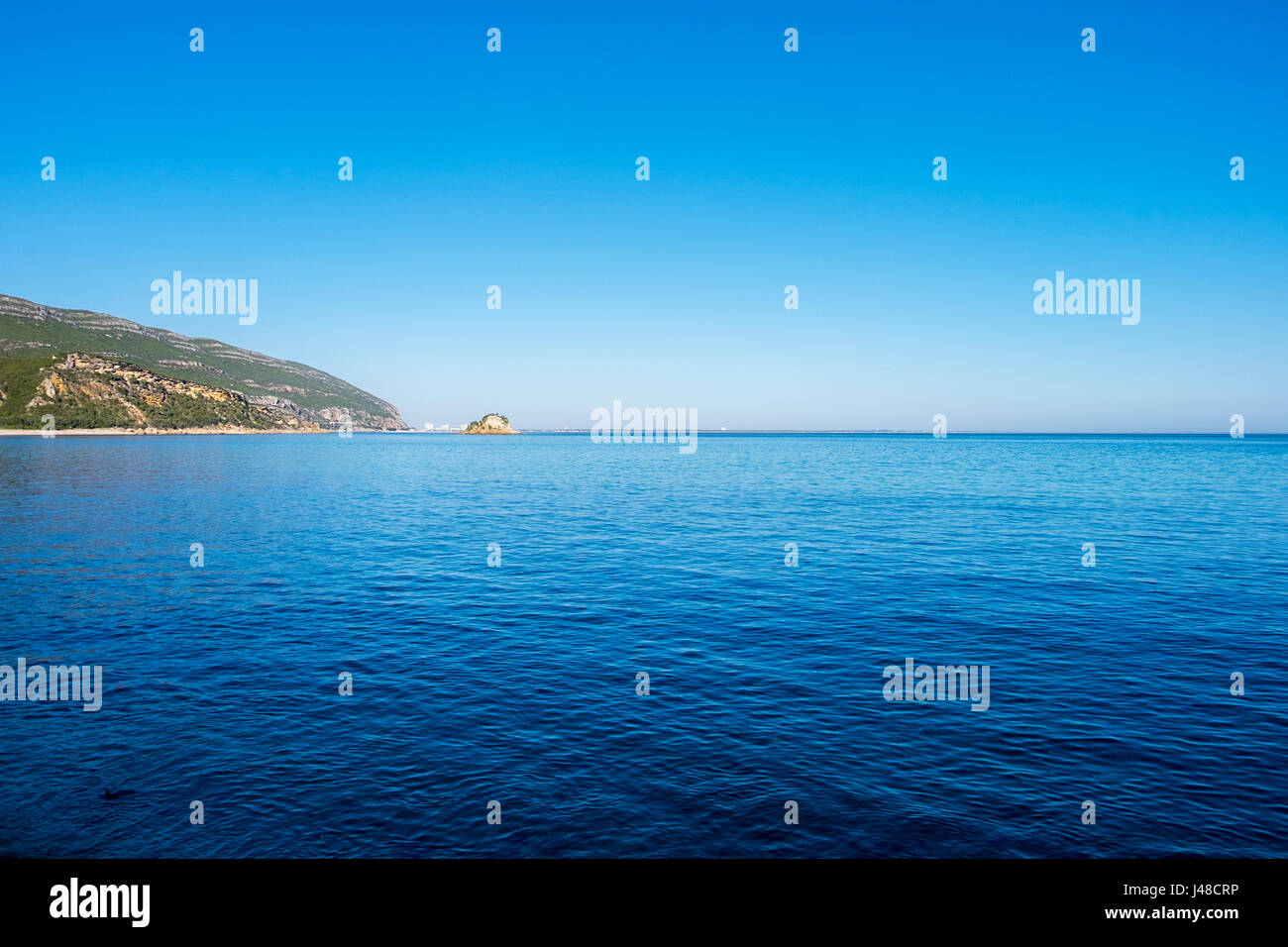 View of the sea and rocks in the Portinho da Arrabida beach in Setubal ...
