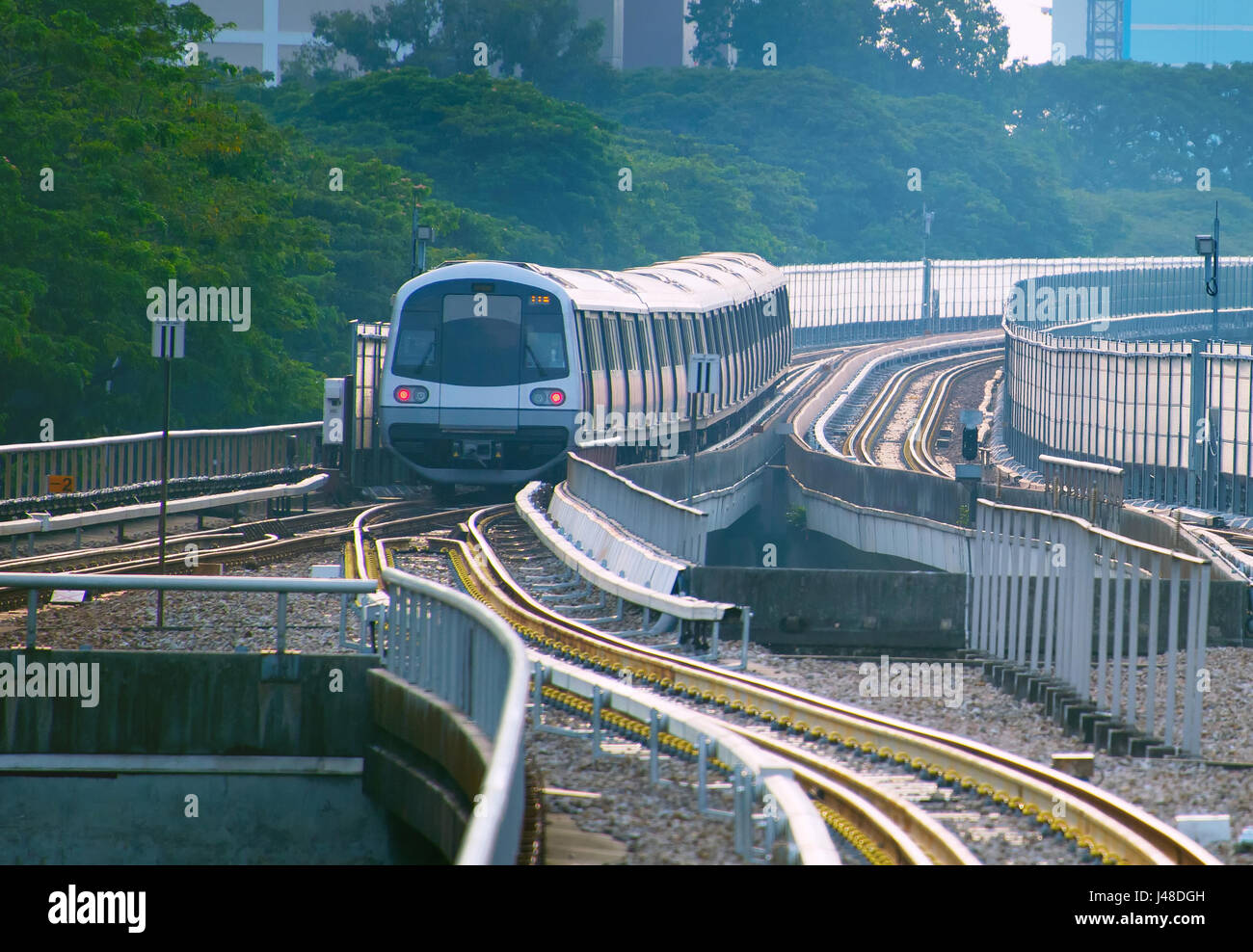 View of modern Singapore MRT train on a railroad Stock Photo - Alamy