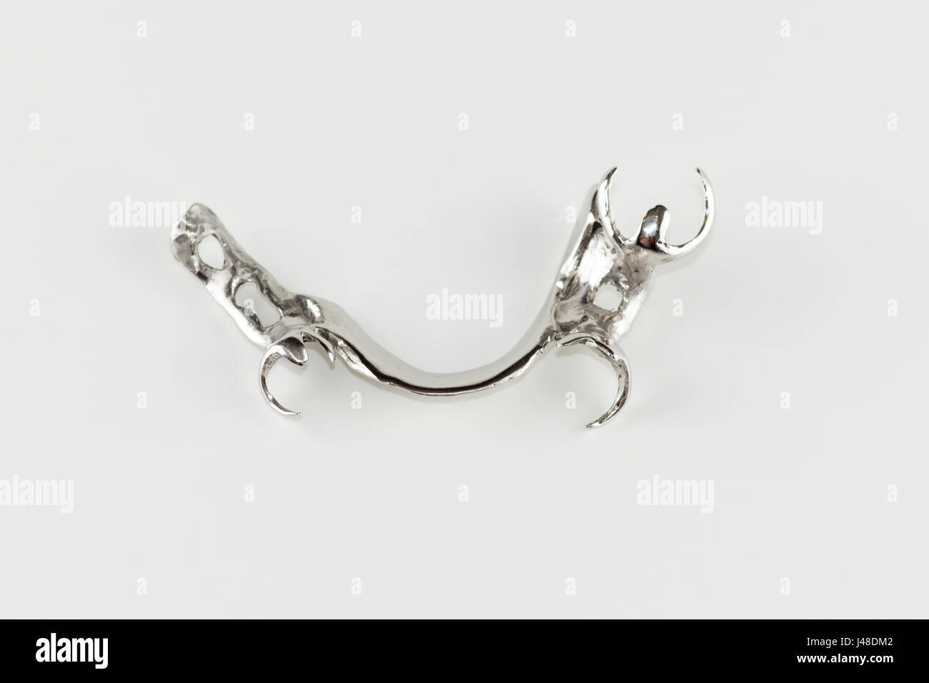 arc prosthesis frame is made of a metal alloy in dental laboratory ...