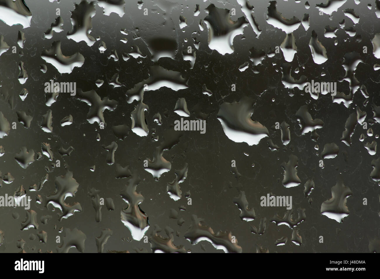 Water droplets and water streams on glass Stock Photo - Alamy
