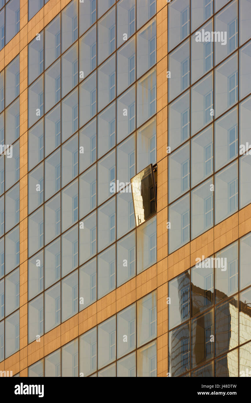 Skyscraper in a business center, only one window open Stock Photo - Alamy