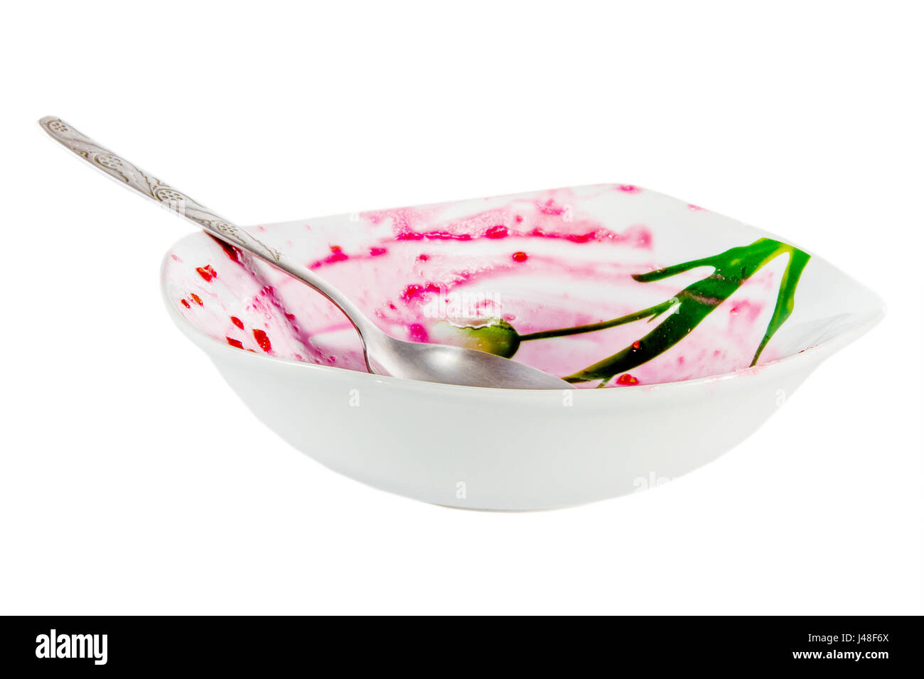 a dirty porcelain plate from under the raspberry jam Stock Photo - Alamy