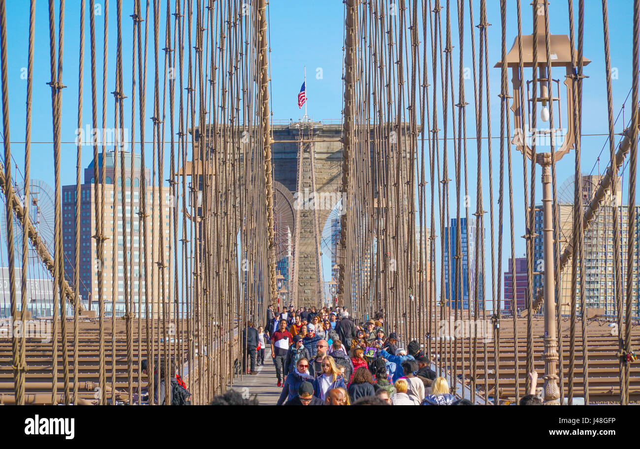 People walking over beautiful Brooklyn Bridge in New York- MANHATTAN ...