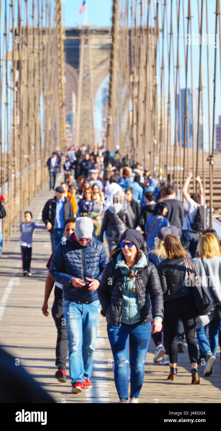 People walking over beautiful Brooklyn Bridge in New York- MANHATTAN ...
