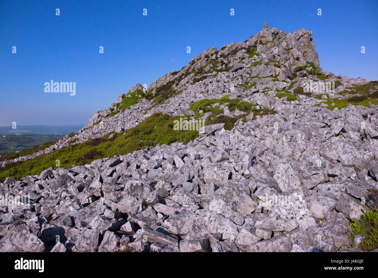 Manstone Rock on the Stiperstones, Shropshire, illuminated by moonlight ...