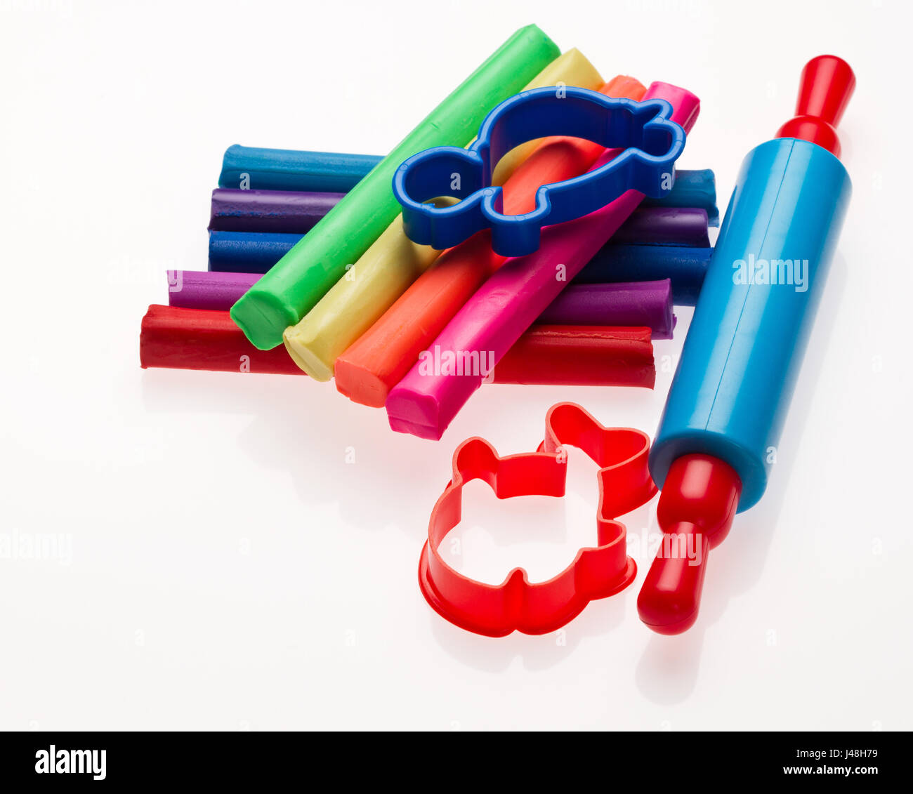 Colorful plasticine and tools on white background Stock Photo - Alamy