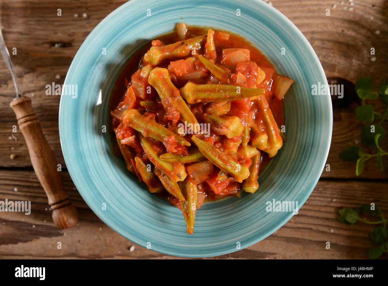 Okra dish with tomatoes (Traditional greek, romanian, bulgarian and ...