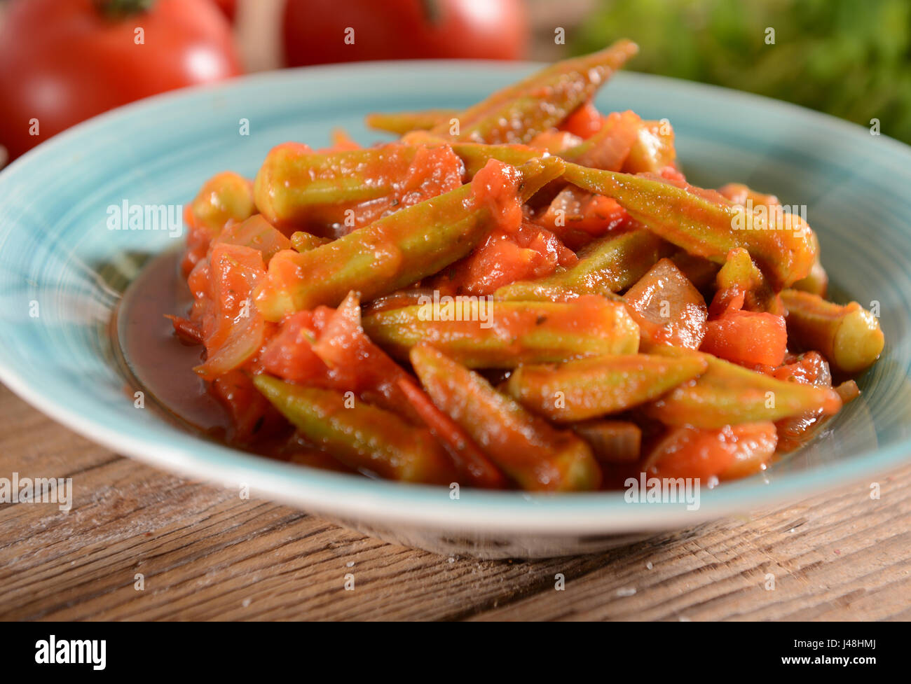 Okra dish with tomatoes (Traditional greek, romanian, bulgarian and ...