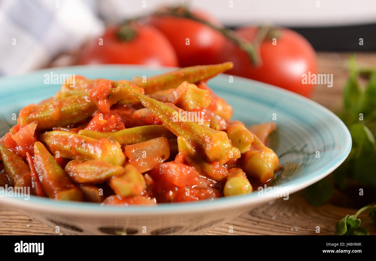 Okra dish with tomatoes (Traditional greek, romanian, bulgarian and ...