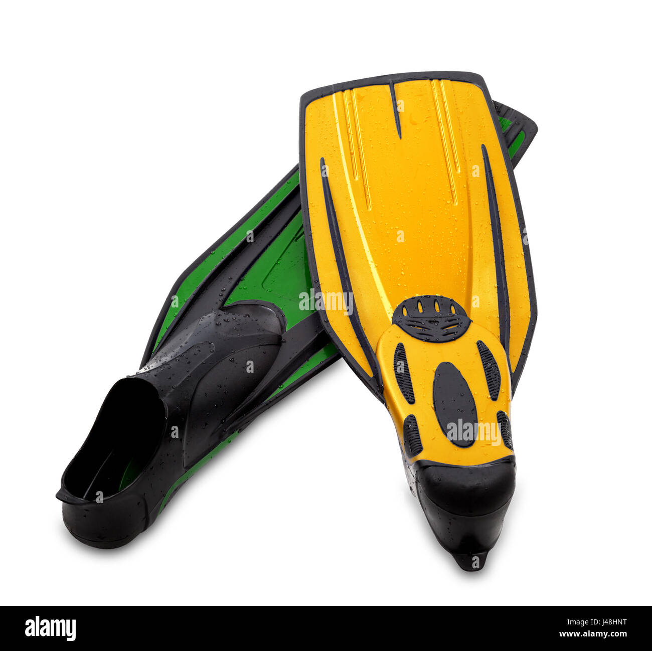 Flippers for diving of different colors with water drops. Isolated on ...