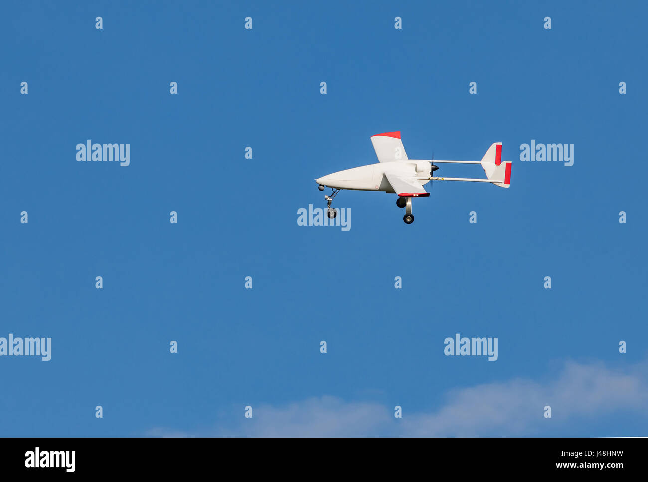 Unmanned aerial vehicle (UAV) in blue sky Stock Photo - Alamy
