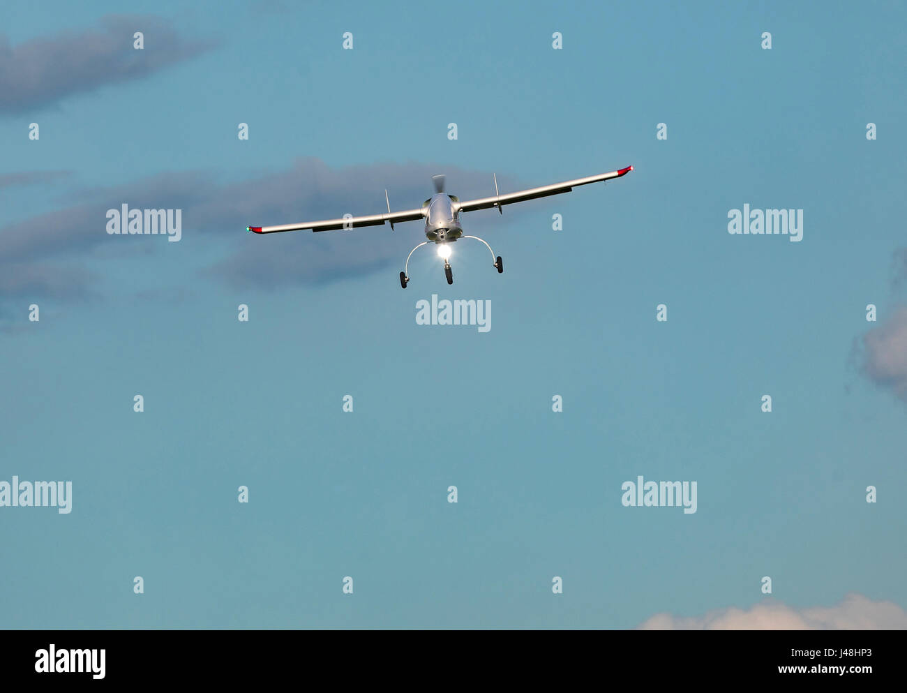 Unmanned aerial vehicle (UAV) in blue sky Stock Photo - Alamy