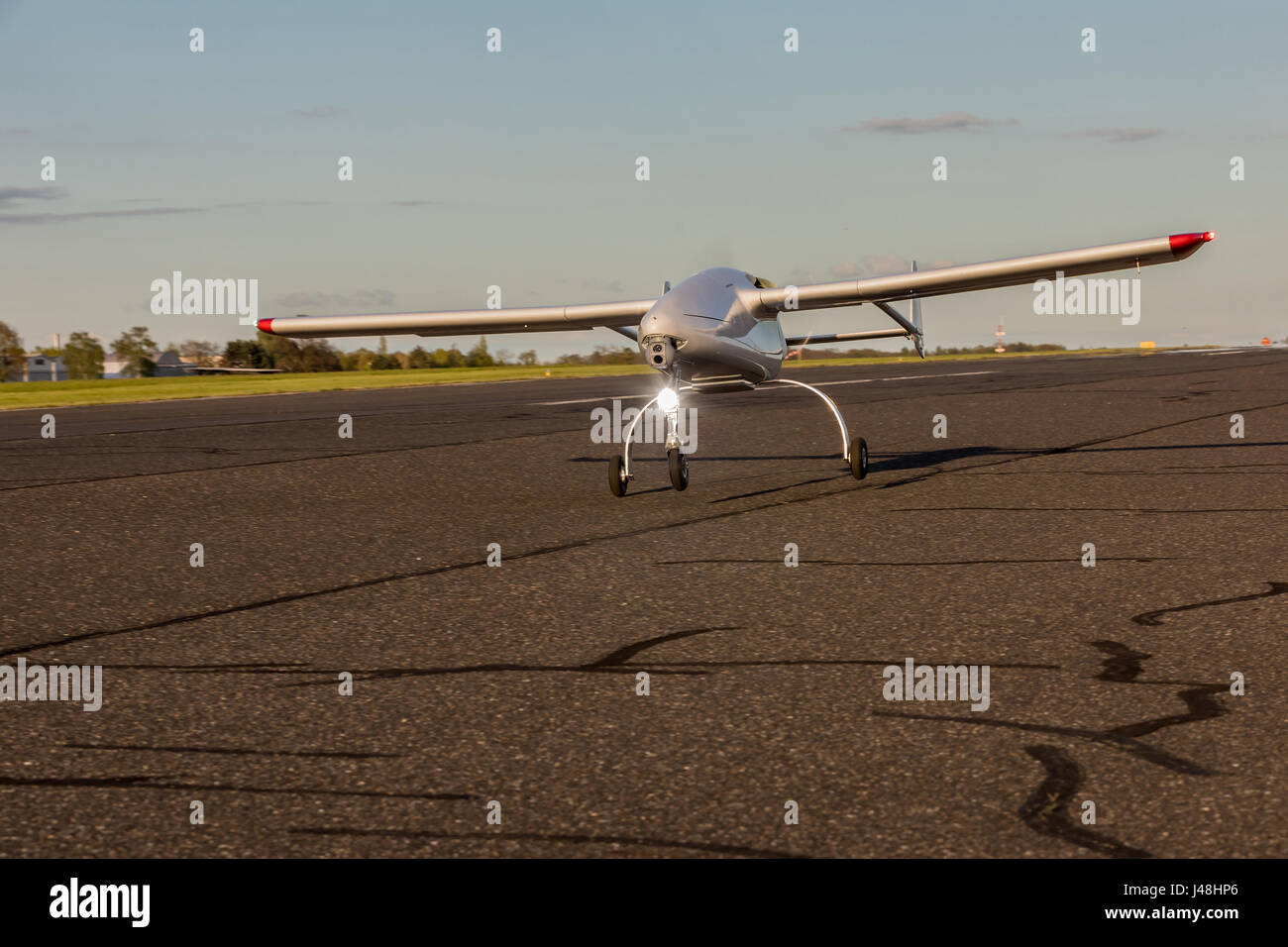Unmanned aerial vehicle (UAV) starts from the asphalt runway Stock ...