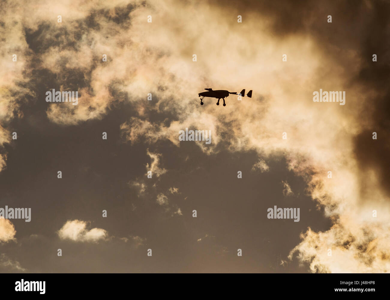 Unmanned aerial vehicle (UAV) in the sky in sunset Stock Photo - Alamy