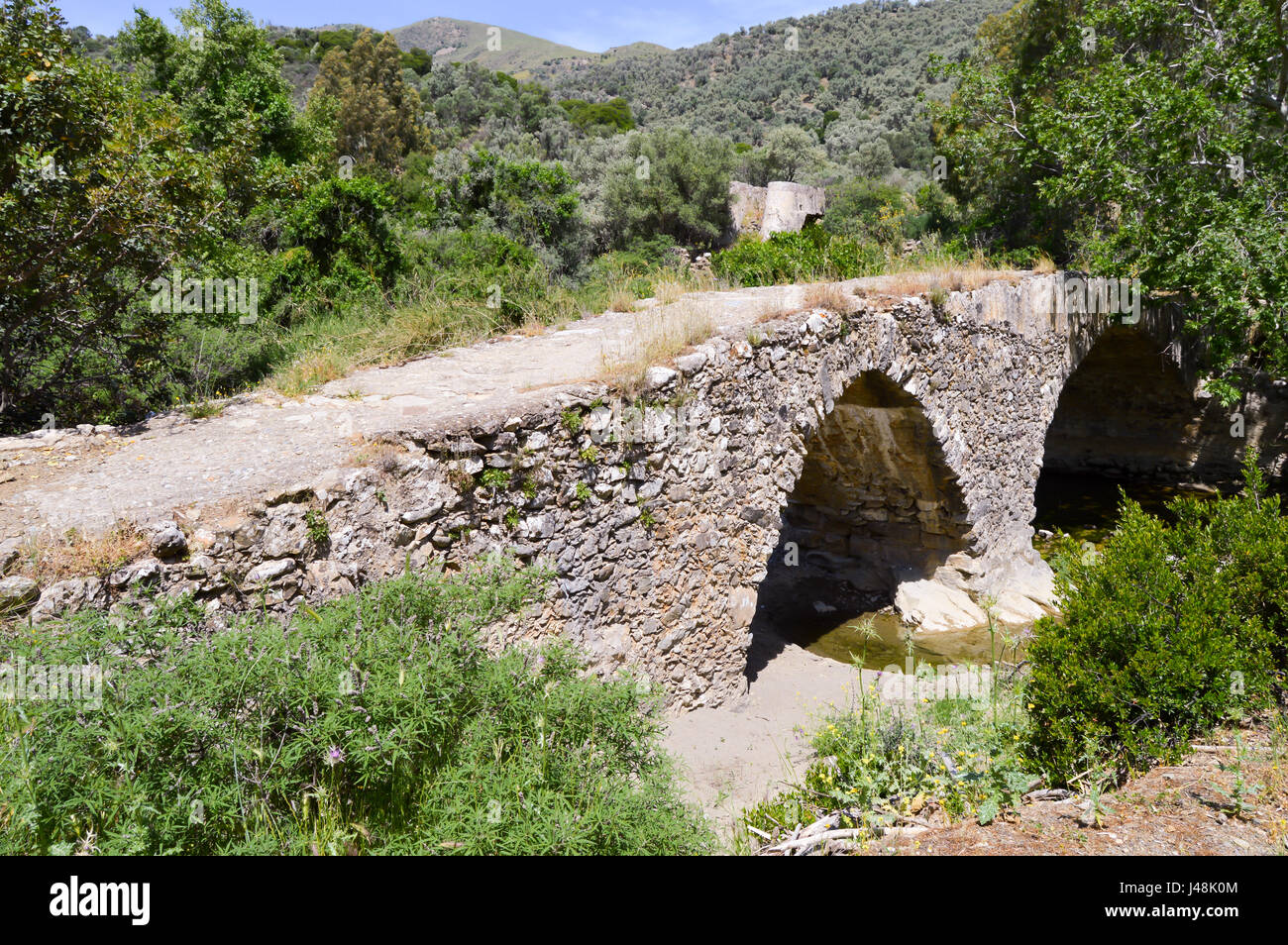 Old stone bridge with arches in the mountains of central Crete Stock ...