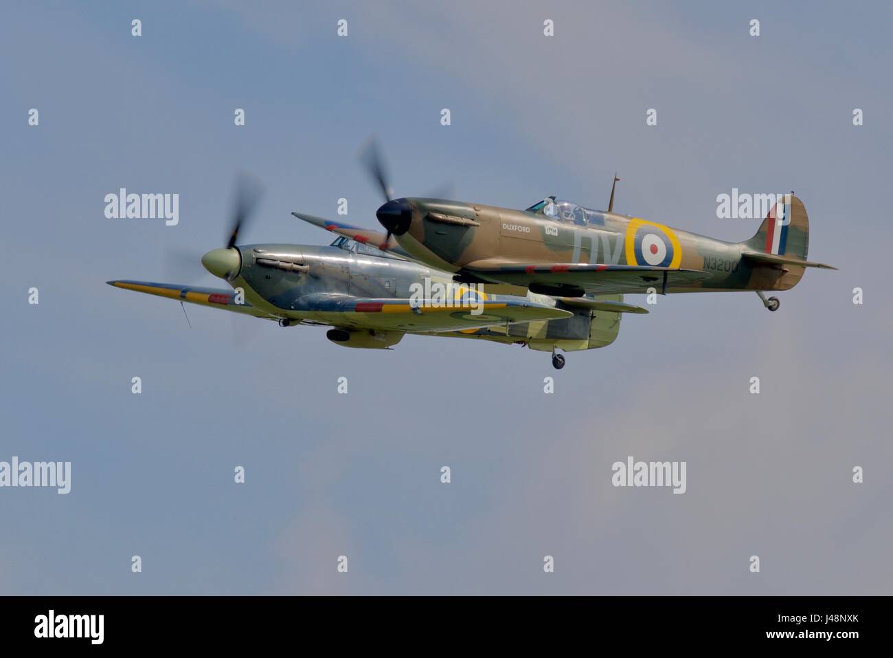 Supermarine Spitfire flying in formation with a Hawker Sea Hurricane ...