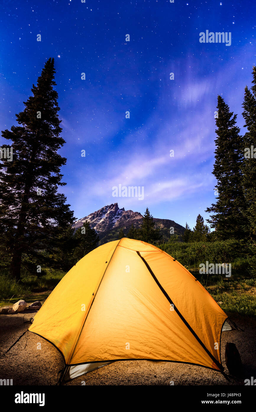 Tent and milky way visible in the sky over Teton Range, Grand Teton ...