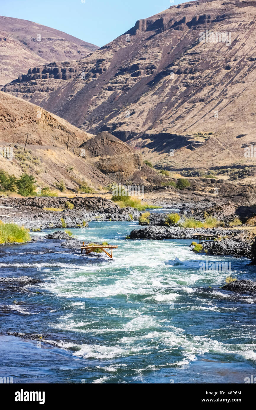 Landscape of arid hills and a flowing river Stock Photo - Alamy