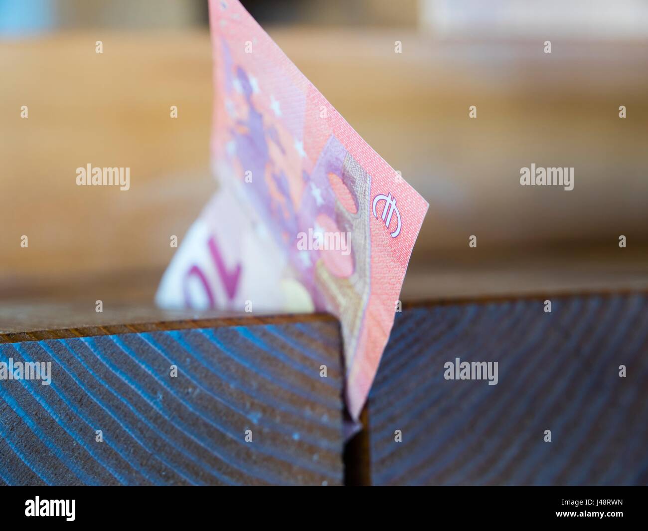 Squeezed money euro hi-res stock photography and images - Alamy