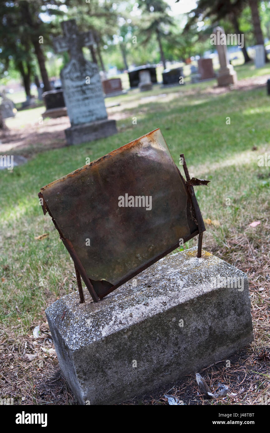 A Rusted Metal Plate On An Old Tombstone; Edmonton, Alberta, Canada ...