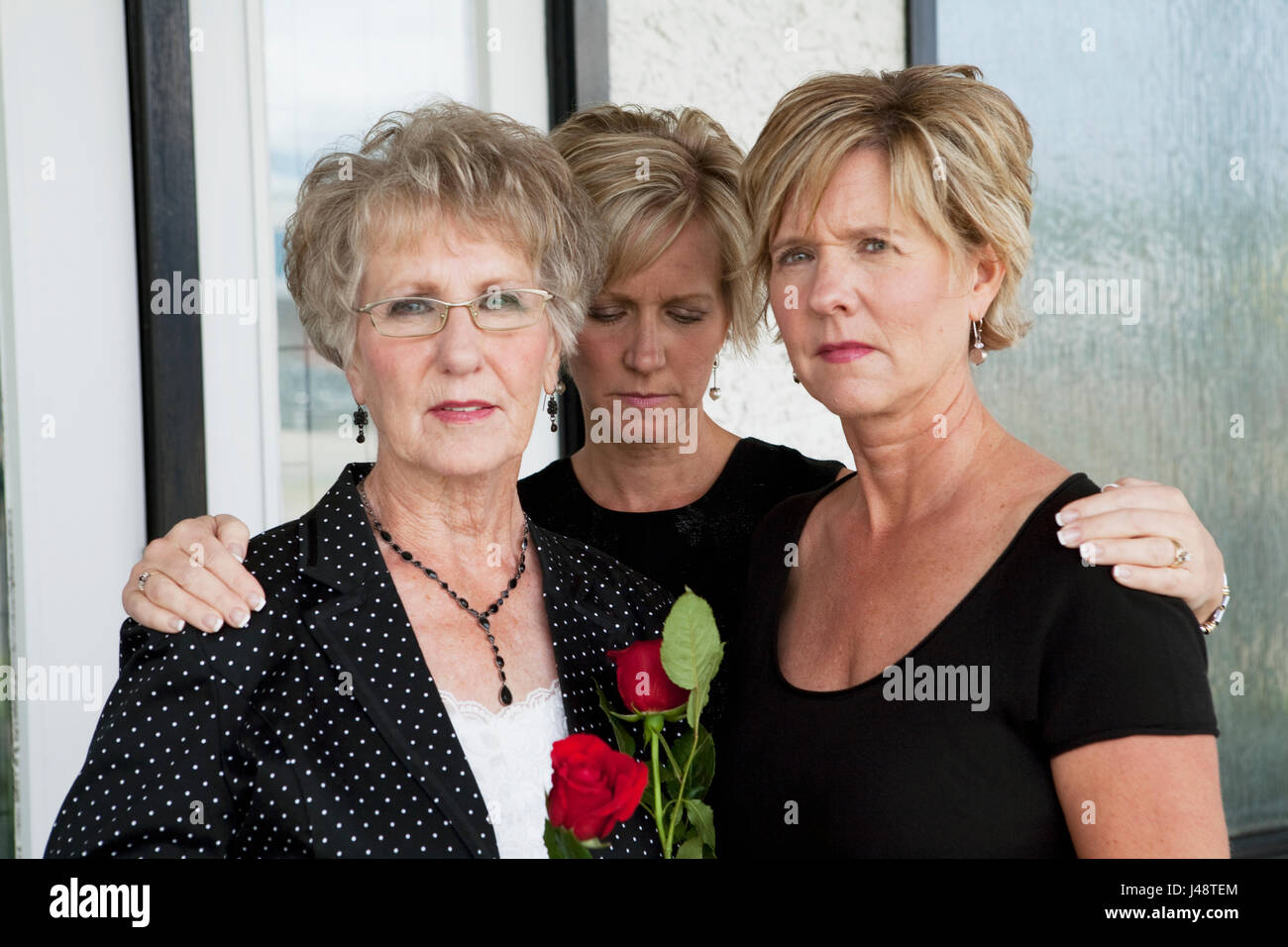 A Mother And Her Two Daughters Grieving A Death; Edmonton, Alberta ...