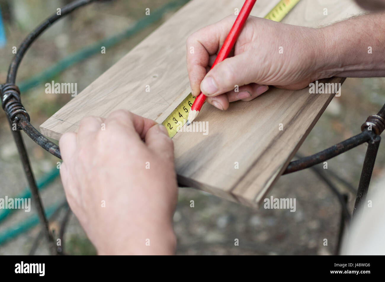 Carpenter is measuring a product with ruler. Furniture making Stock ...