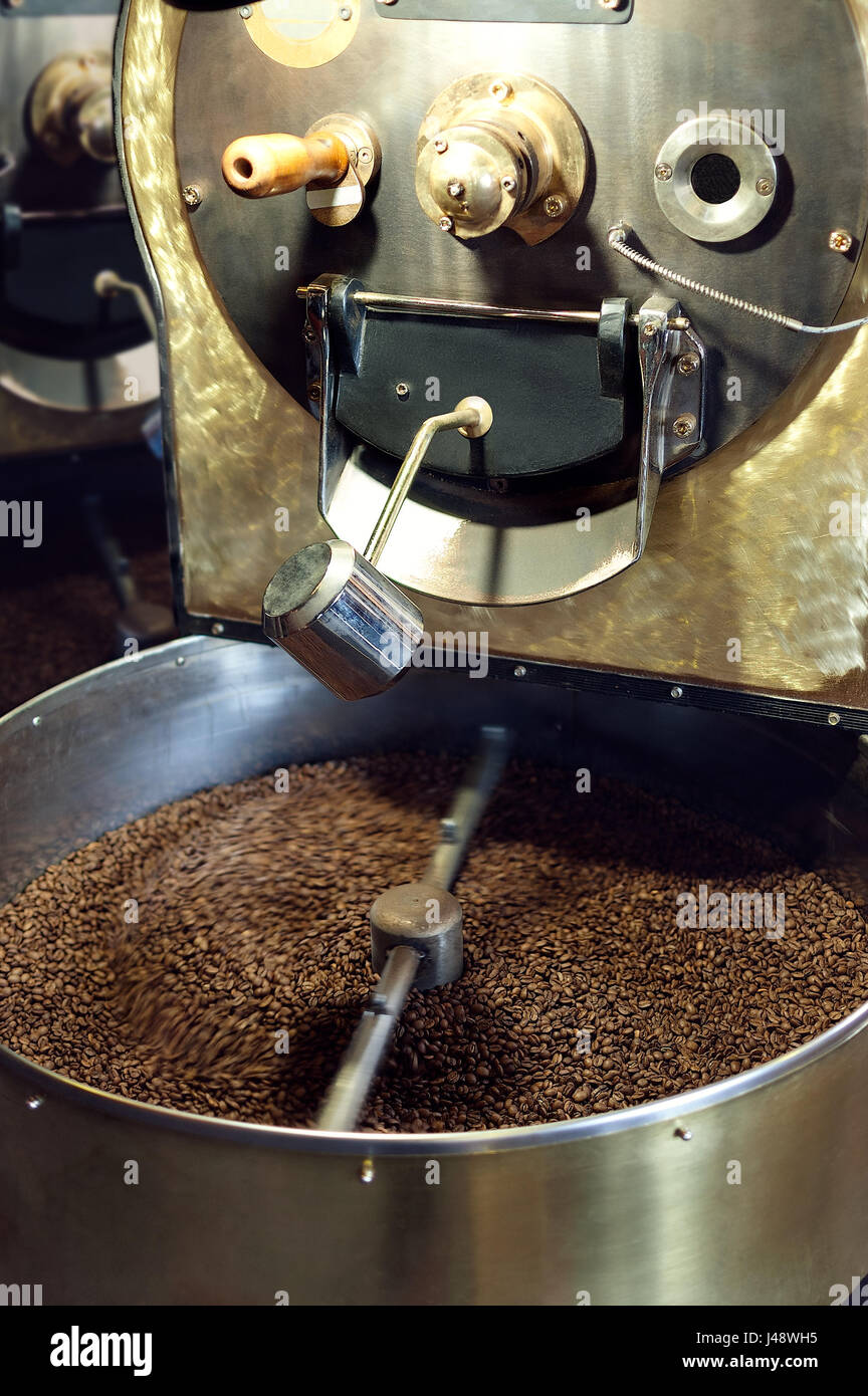 Freshly roasted coffee beans in a coffee roaster Stock Photo - Alamy