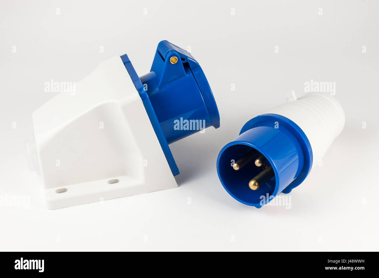 Electric plastic power plug and wall socket with cap isolated on white ...