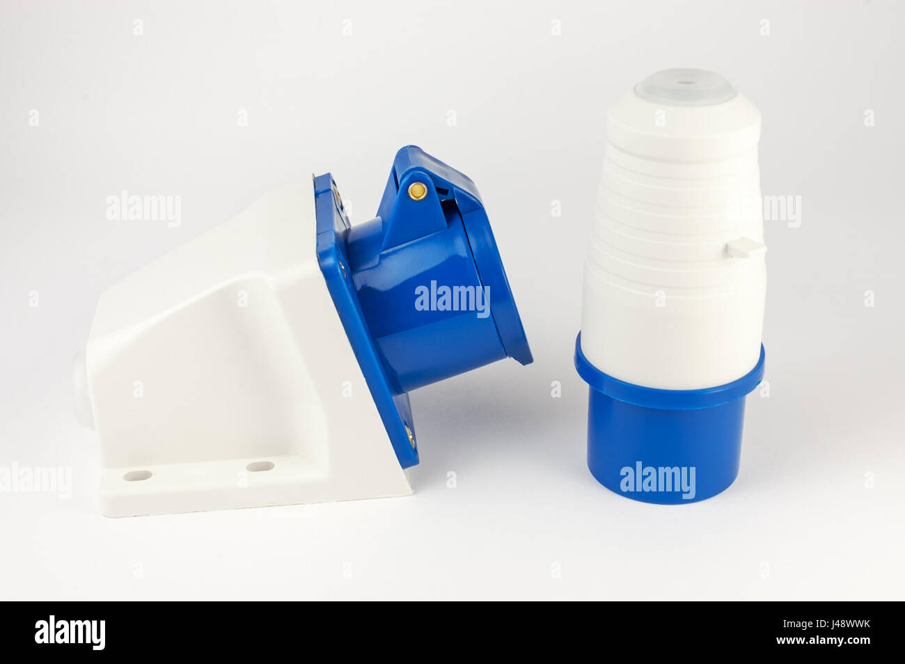 Electric plastic power plug and wall socket with cap isolated on white ...