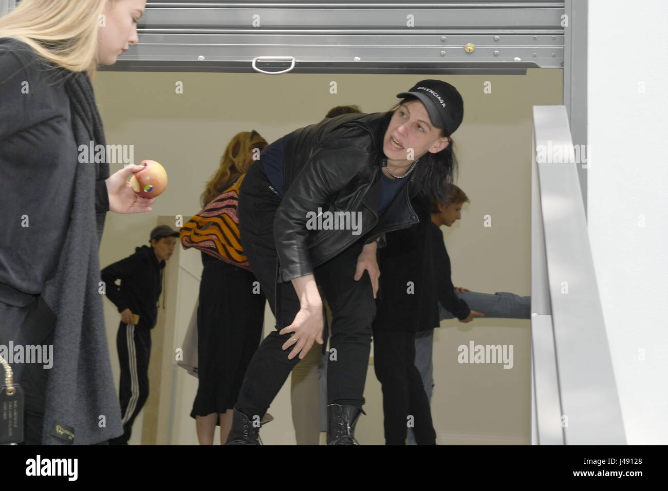 Venice, Italy. 10th May, 2017. Artist Anne Imhof (c), photographed ...