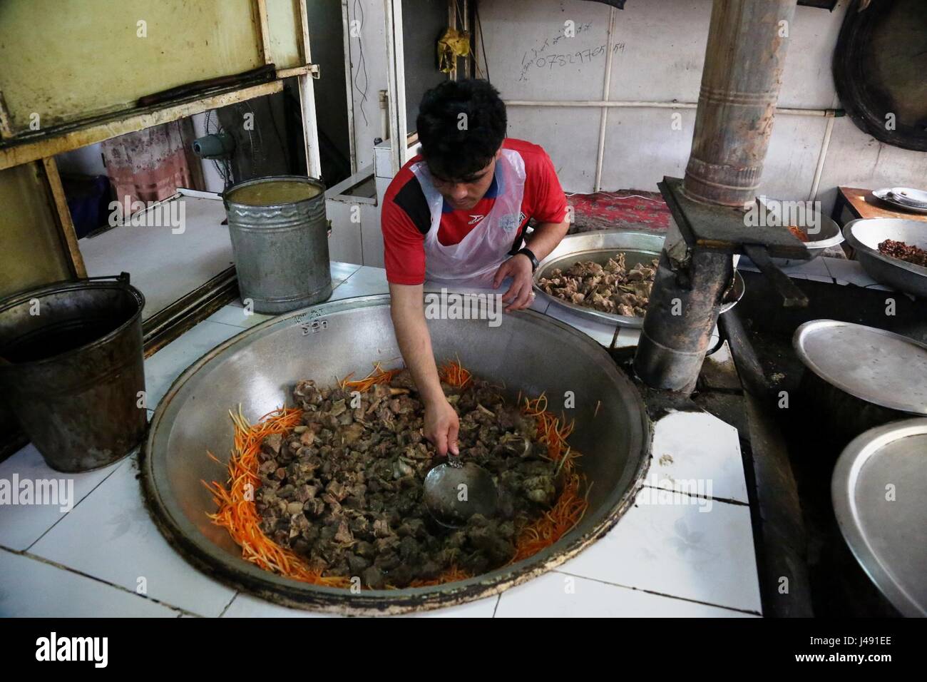 Kabul, Afghanistan. 3rd Apr, 2017. A chef cooks traditional Afghan ...